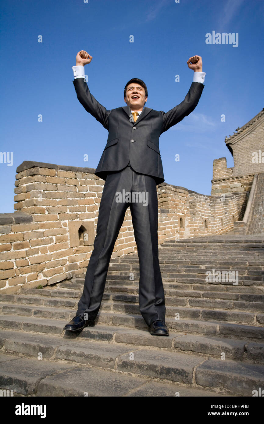 Happy businessman on the Great Wall Stock Photo - Alamy