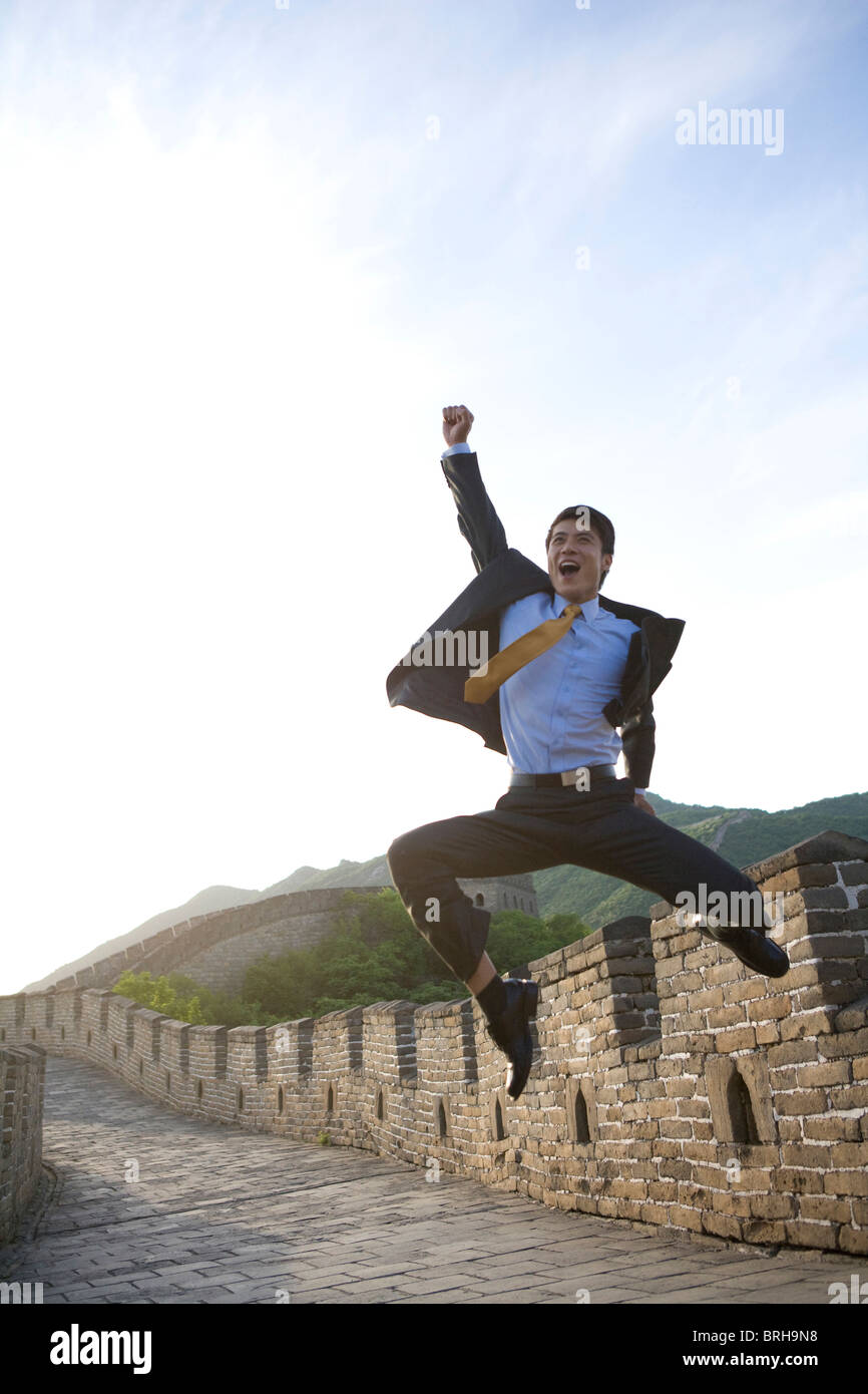 Happy businessman on the Great Wall Stock Photo - Alamy