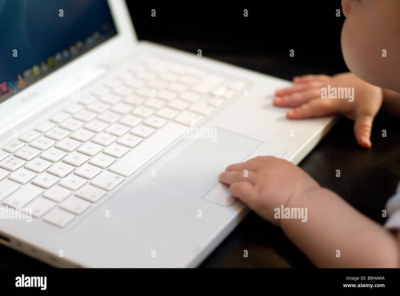 Baby using laptop Stock Photo - Alamy