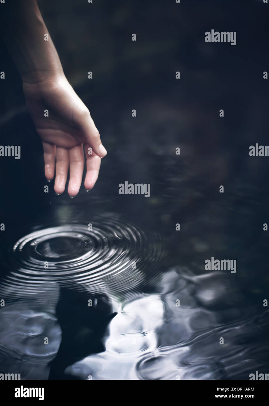 hand entering the water Stock Photo - Alamy