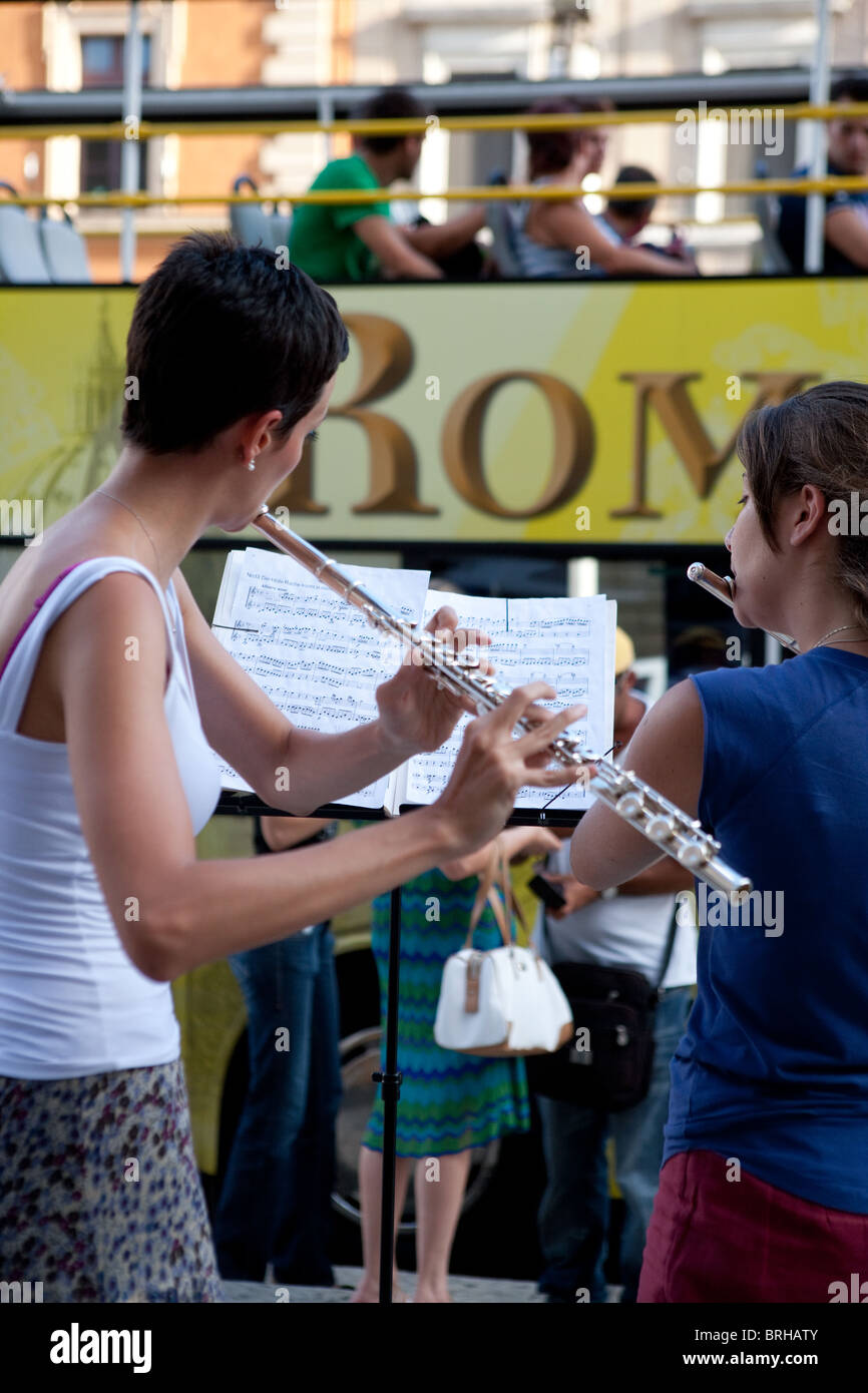 Buskers street musicians artists players play city Stock Photo - Alamy