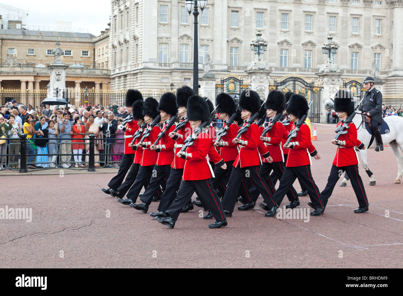 Queen's guardsmen march outside Buckingham Palace during changing of ...