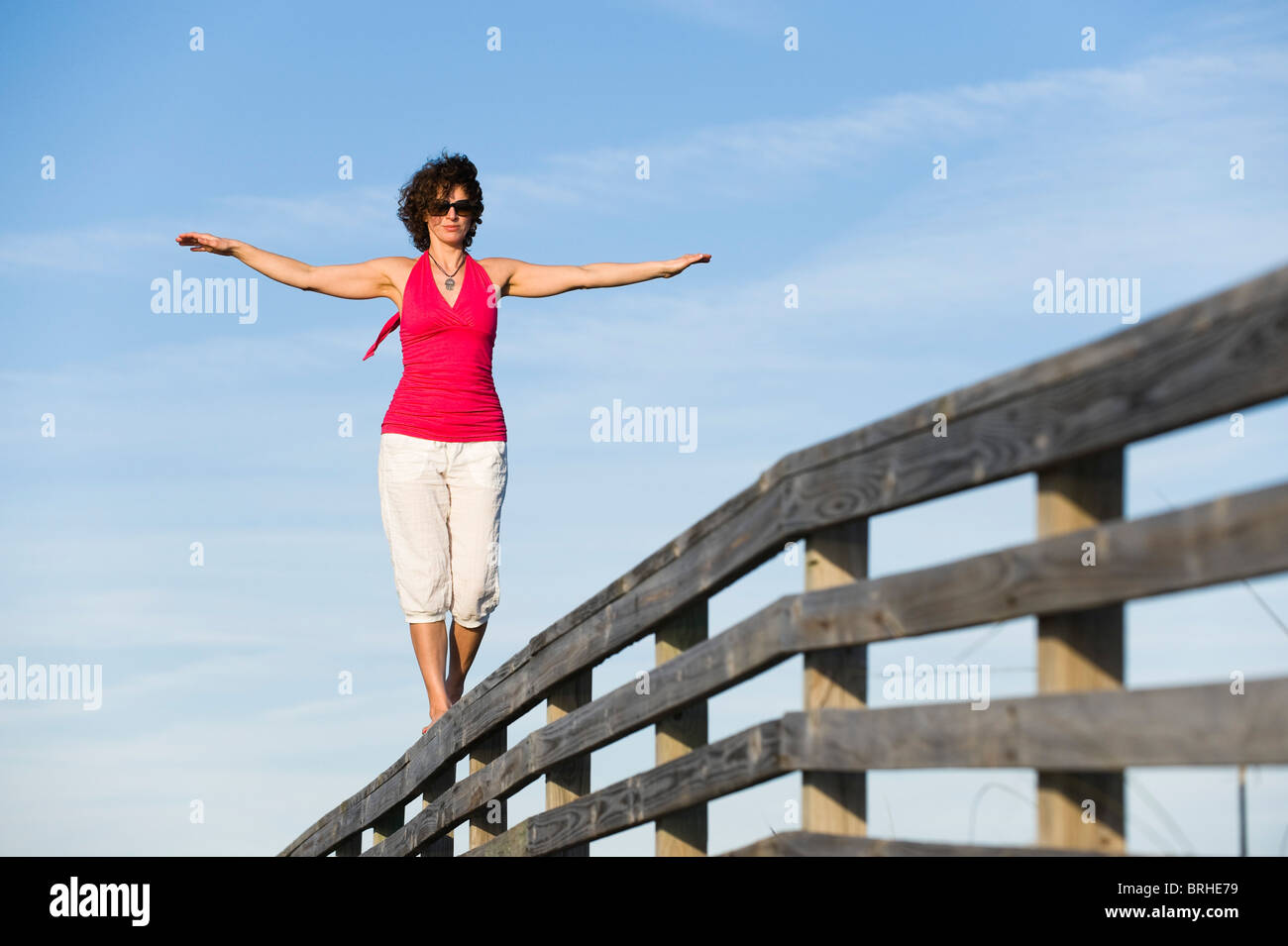 Woman Balancing on Wooden Railing, Honeymoon Island State Park, Florida ...