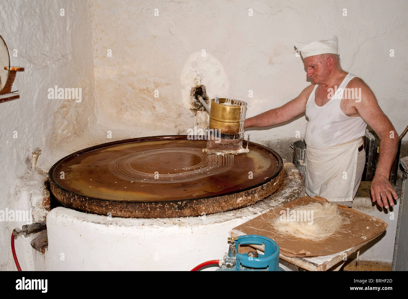 Making Kataifi, a very fine thread like pastry used in traditional ...
