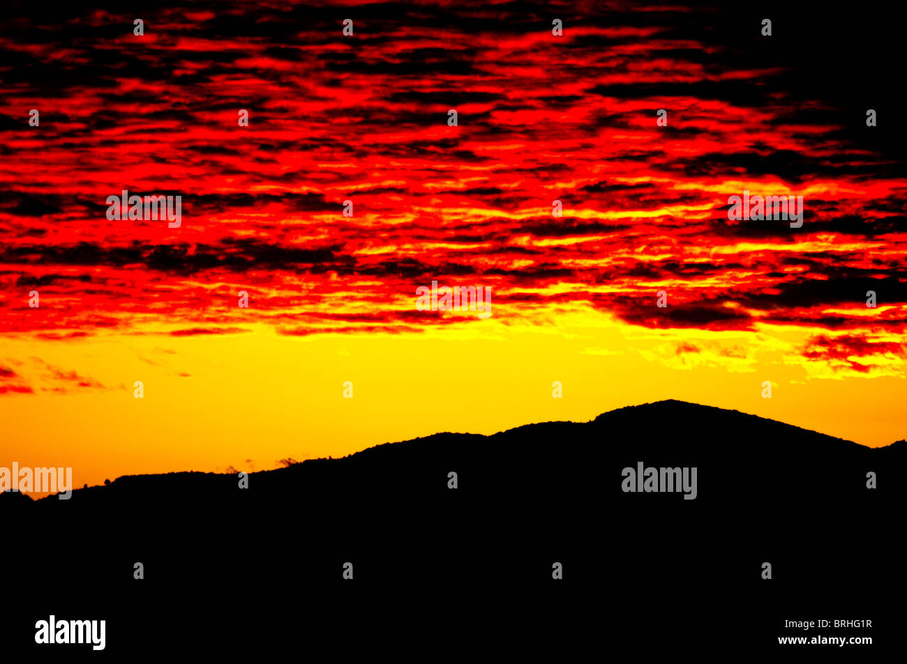 Italy, sunset over the mountains Stock Photo - Alamy