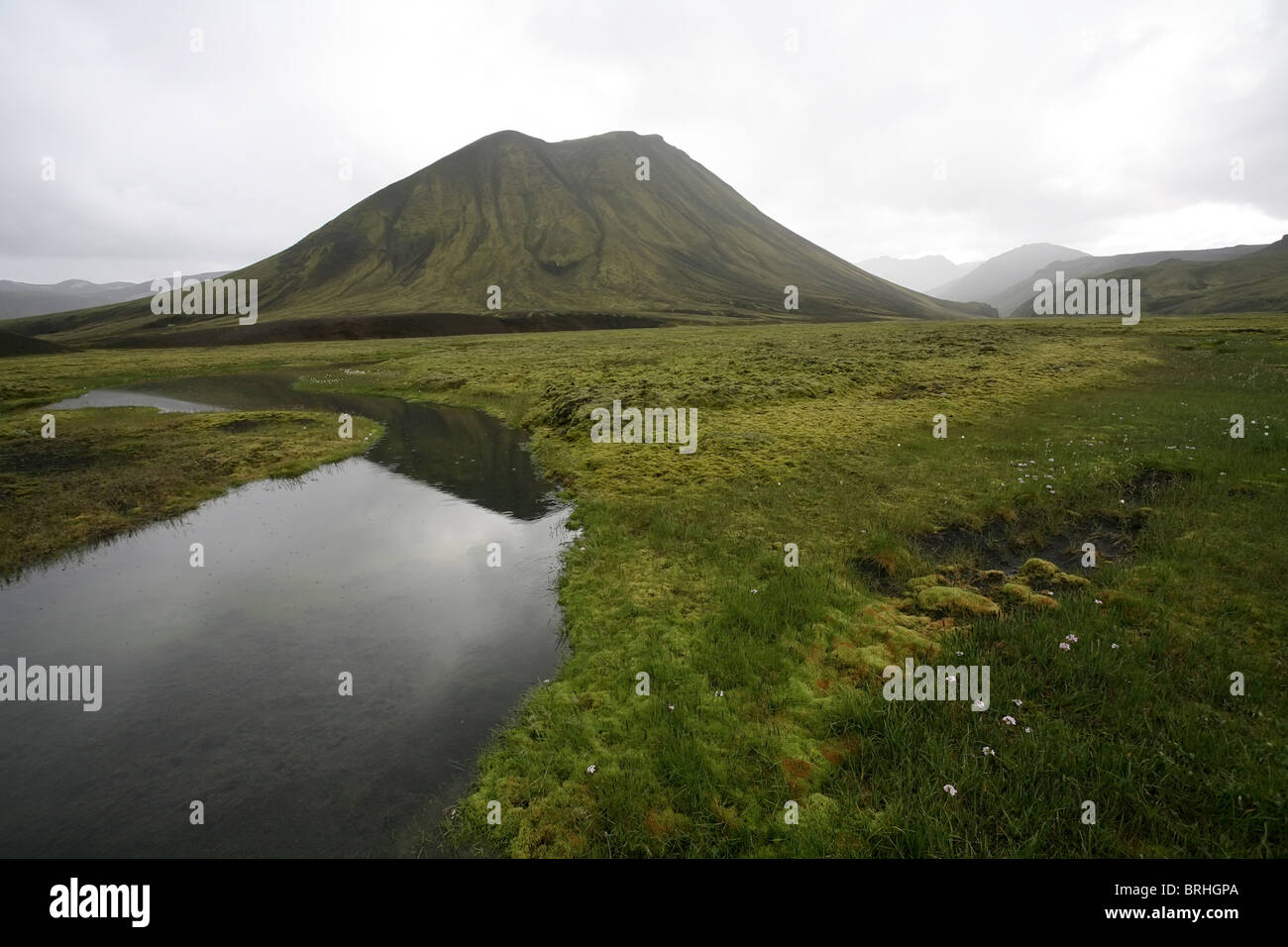Iceland landscape with lone mountain and twisting river Stock Photo - Alamy