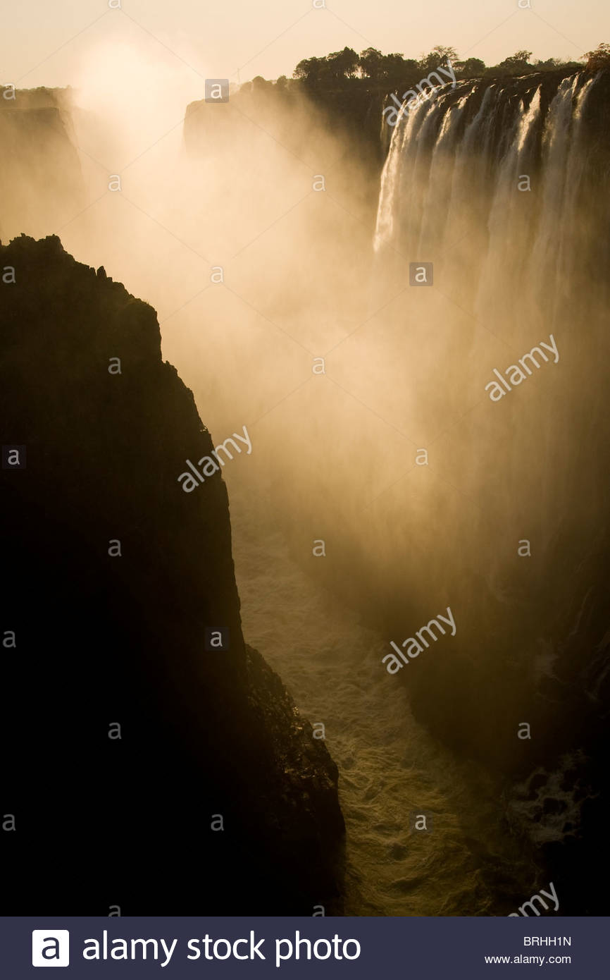 Sunlight illuminates mist rising from Victoria Falls Stock Photo - Alamy