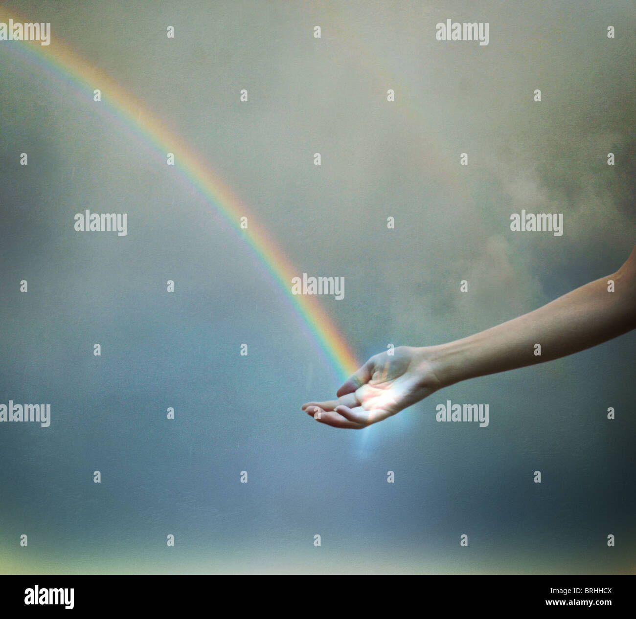 rainbow touching a hand Stock Photo - Alamy