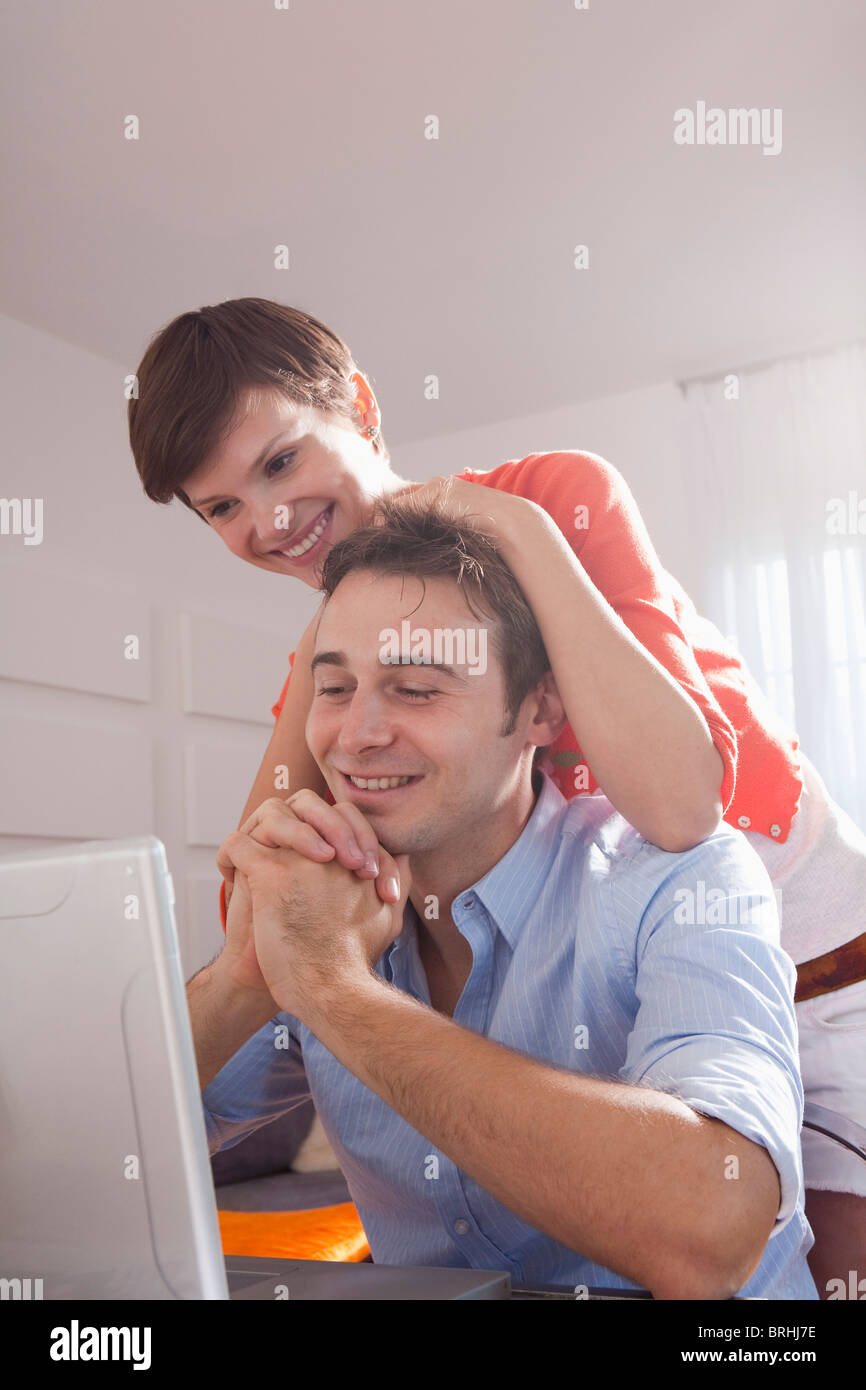 Young Couple using Computer Stock Photo - Alamy