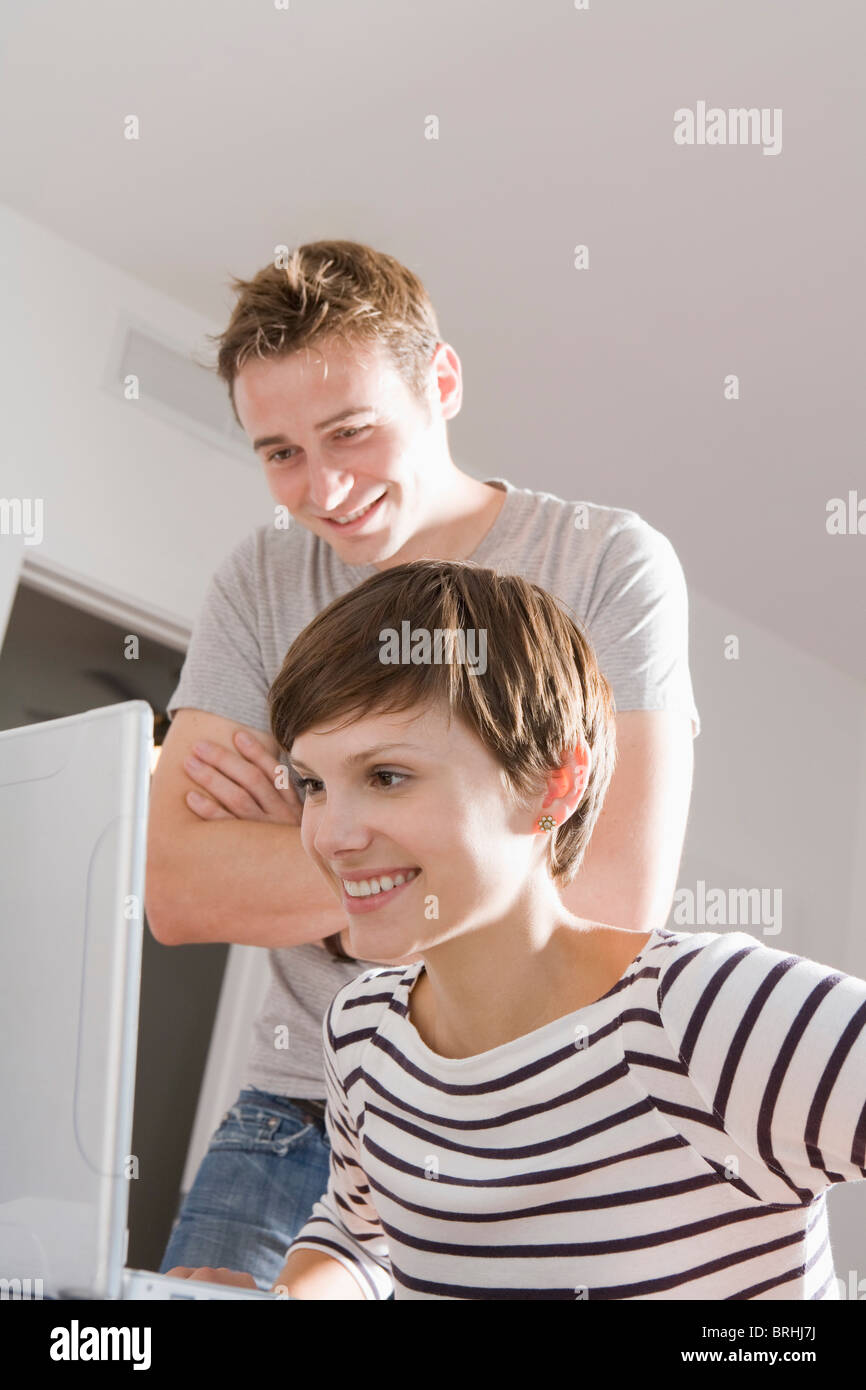 Woman with computer looking relieved hi-res stock photography and ...