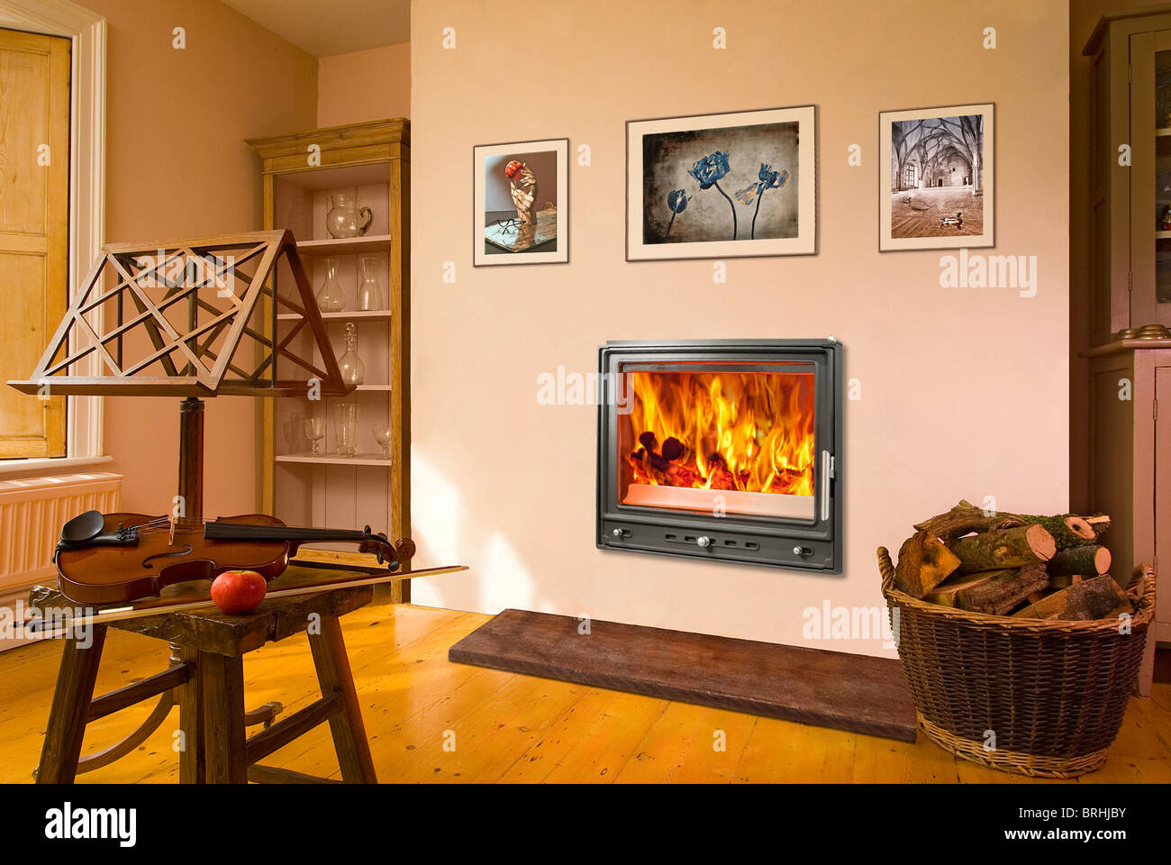 A Woodfire RS18 wood burning stove with flames in a nice interior Stock ...