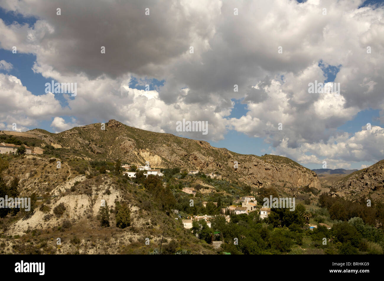 A picturesque Spanish village nestled into the hillside in Andalucia ...