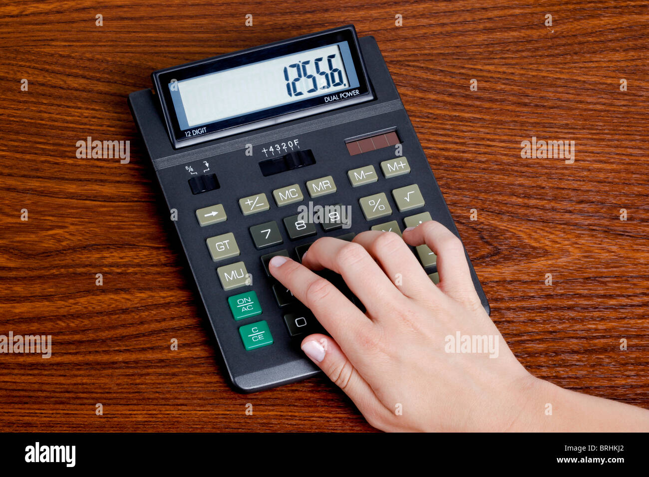 Woman Using Calculator Stock Photo - Alamy