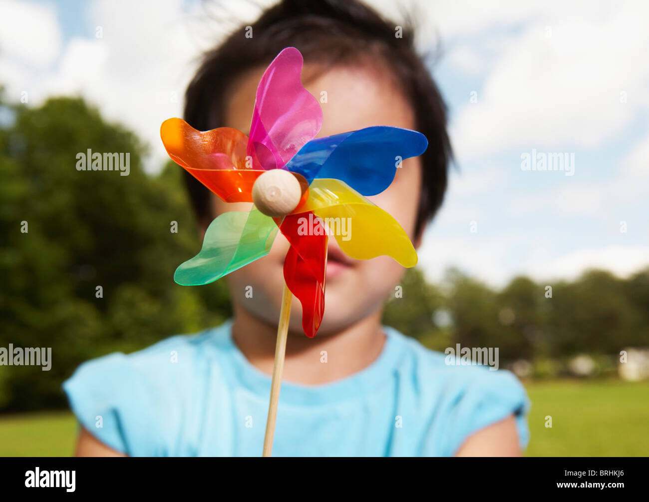 Little Boy Holding a Pinwheel Stock Photo - Alamy