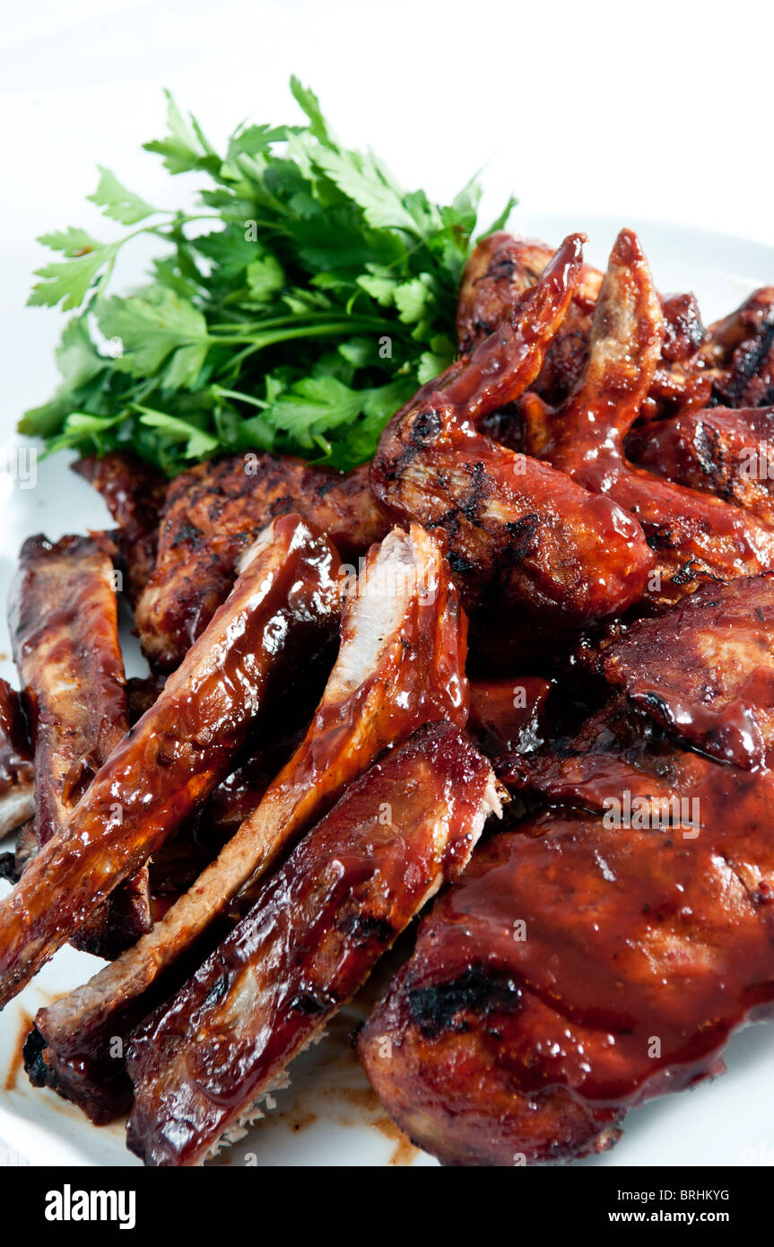 A selection of BBQ meat with salad Stock Photo - Alamy