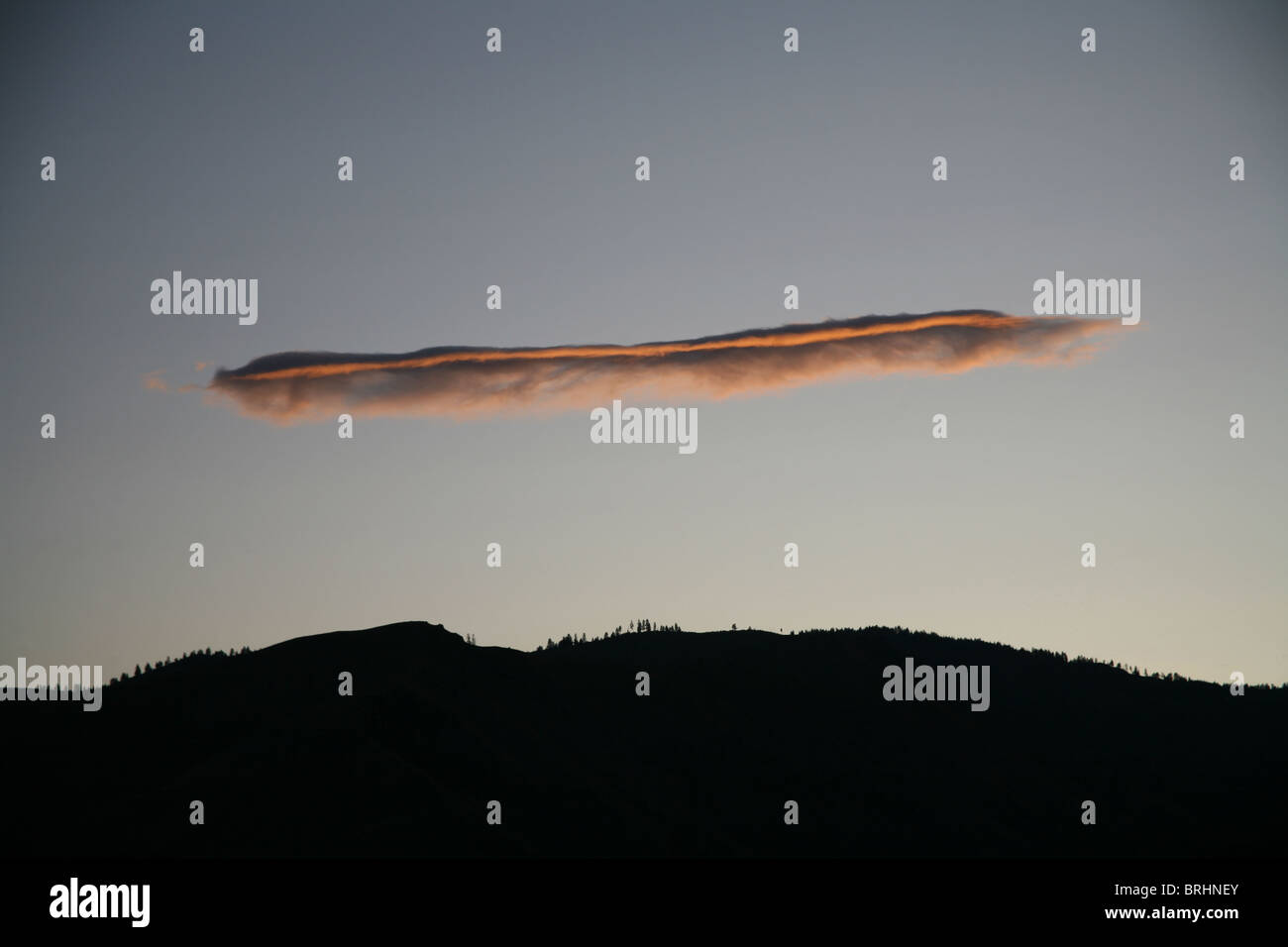 Lone cloud over mountains Stock Photo - Alamy