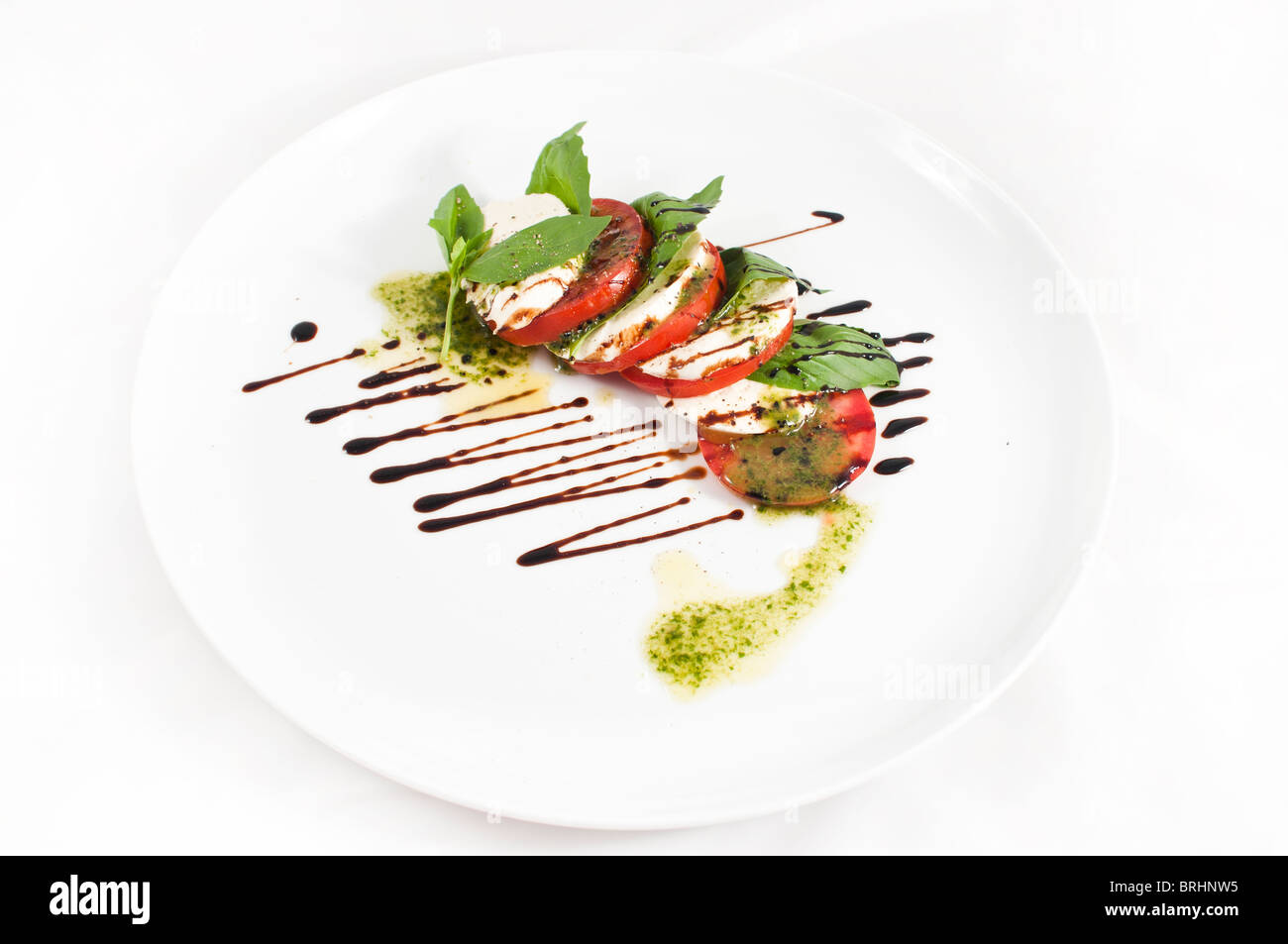 A plate of well presented tomato and mozzarella salad Stock Photo - Alamy