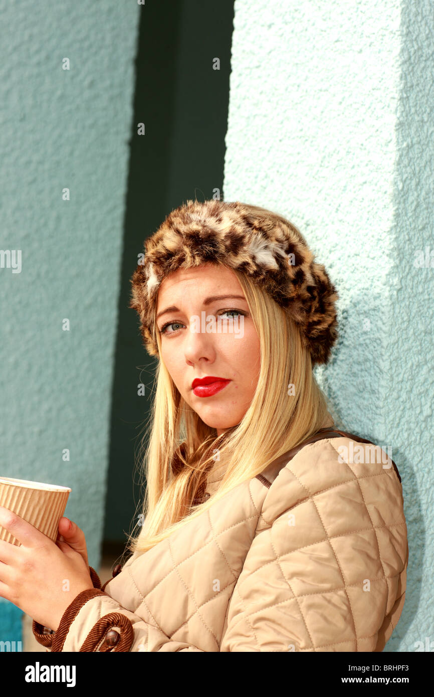 Young Woman Sitting Down Drinking Tea. Model Released Stock Photo - Alamy