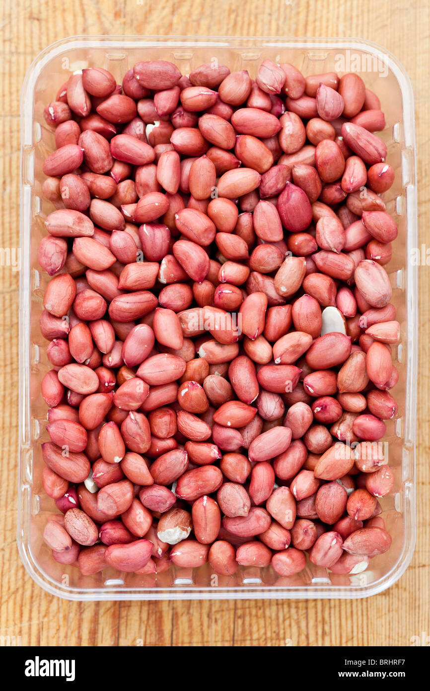 peanuts in a plastic tray Stock Photo - Alamy