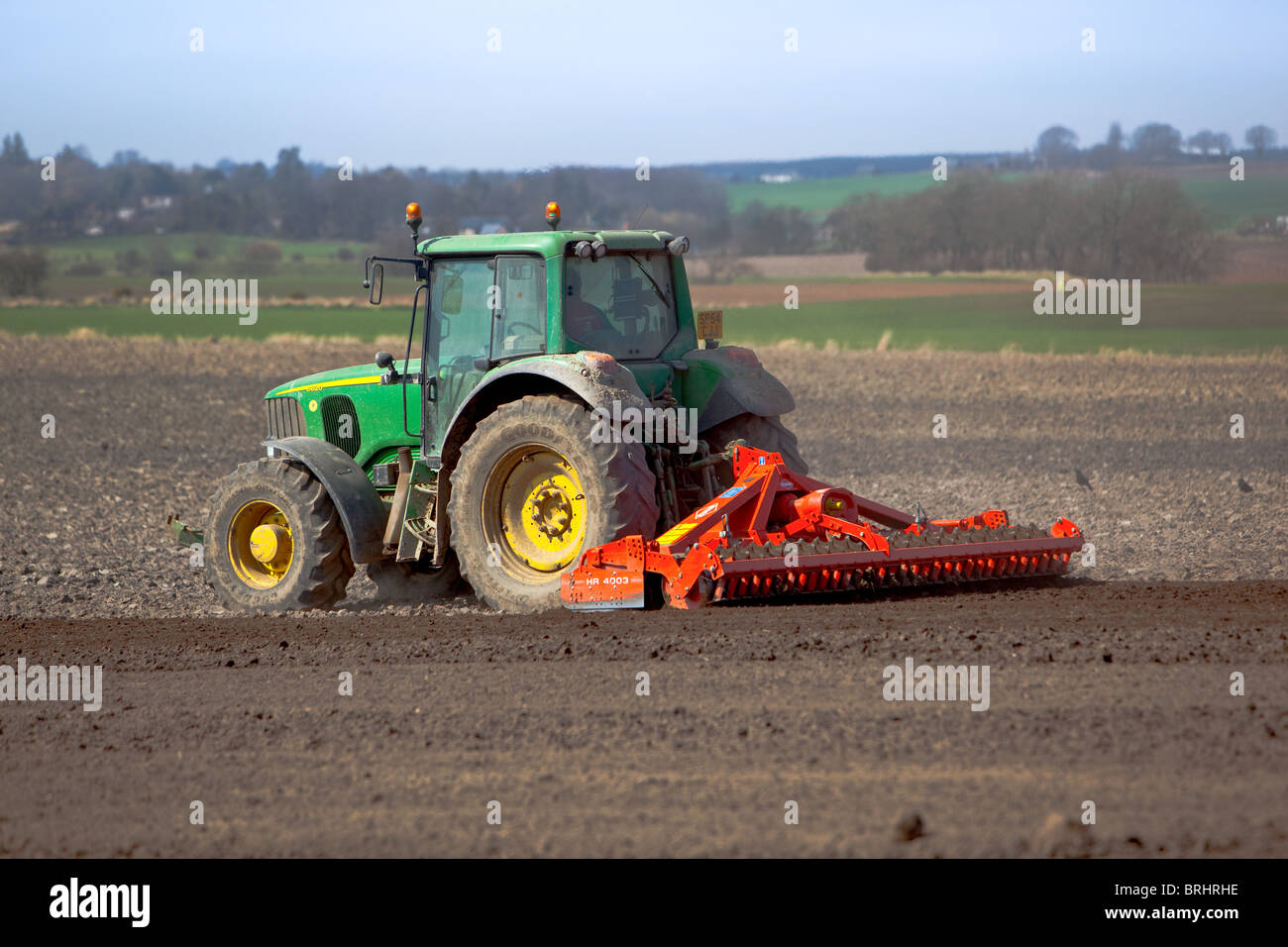 Tractor Harrowing Field In Spring High Resolution Stock Photography and ...
