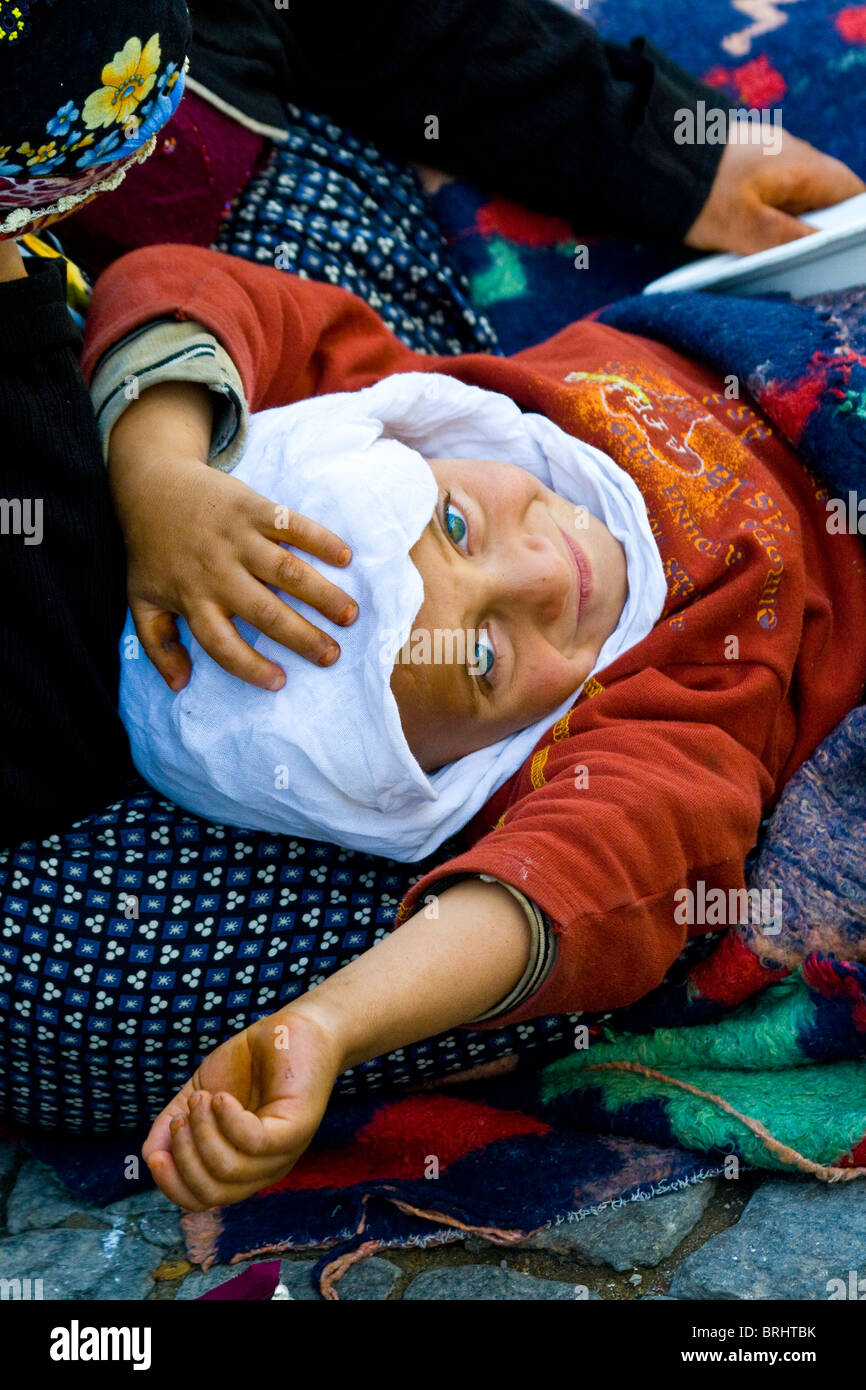 Homeless woman and small child on the street in Kumkapi, Istanbul ...