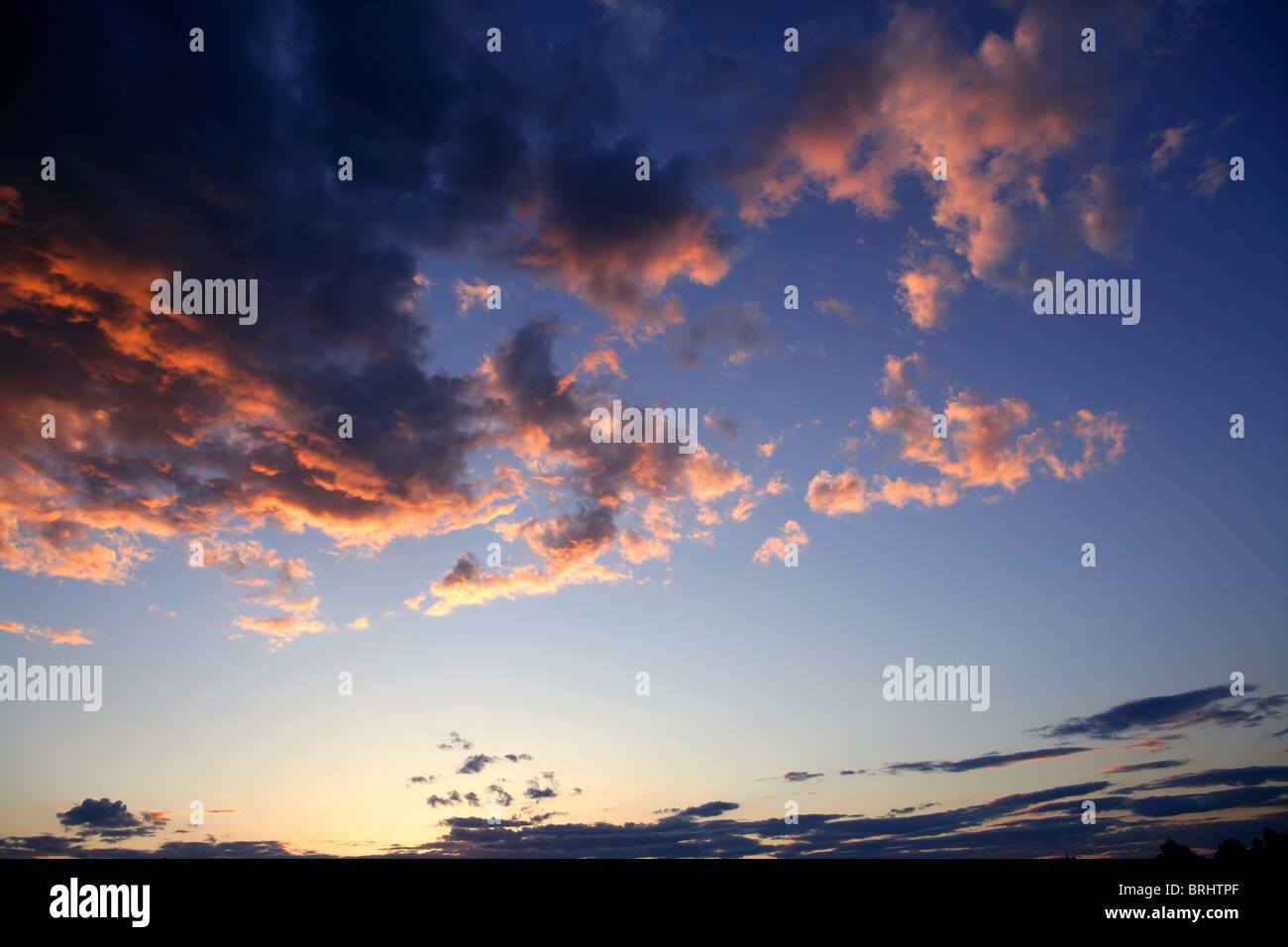 blue red sunset sky background stormy clouds Stock Photo - Alamy