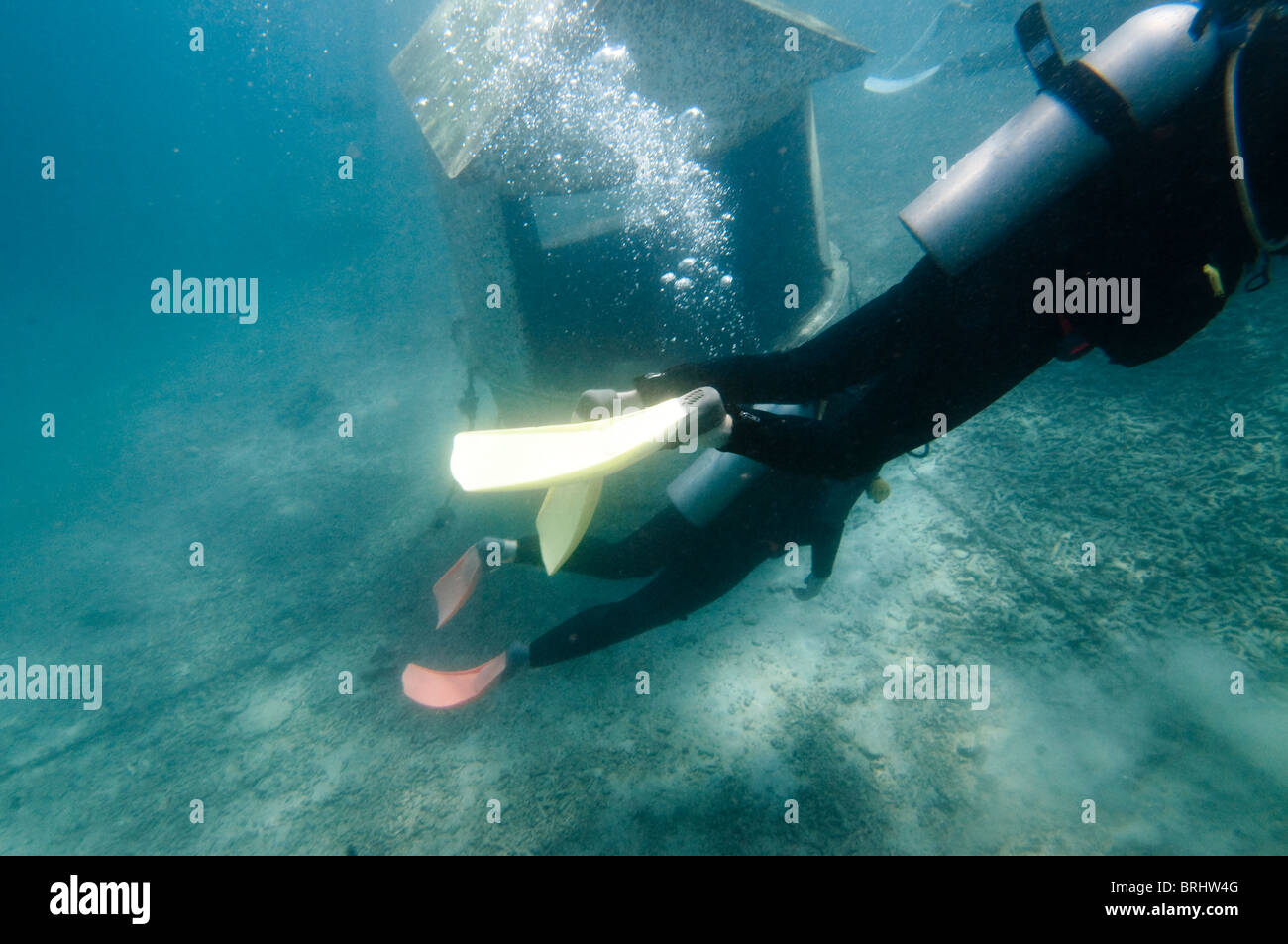 Scuba Divers swimming passed the worlds only Underwater post office ...