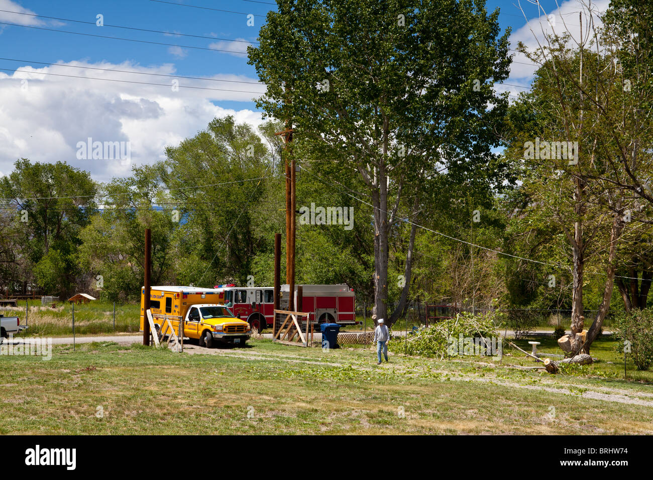 A rural fire departments paramedics treating a man injured by a falling ...