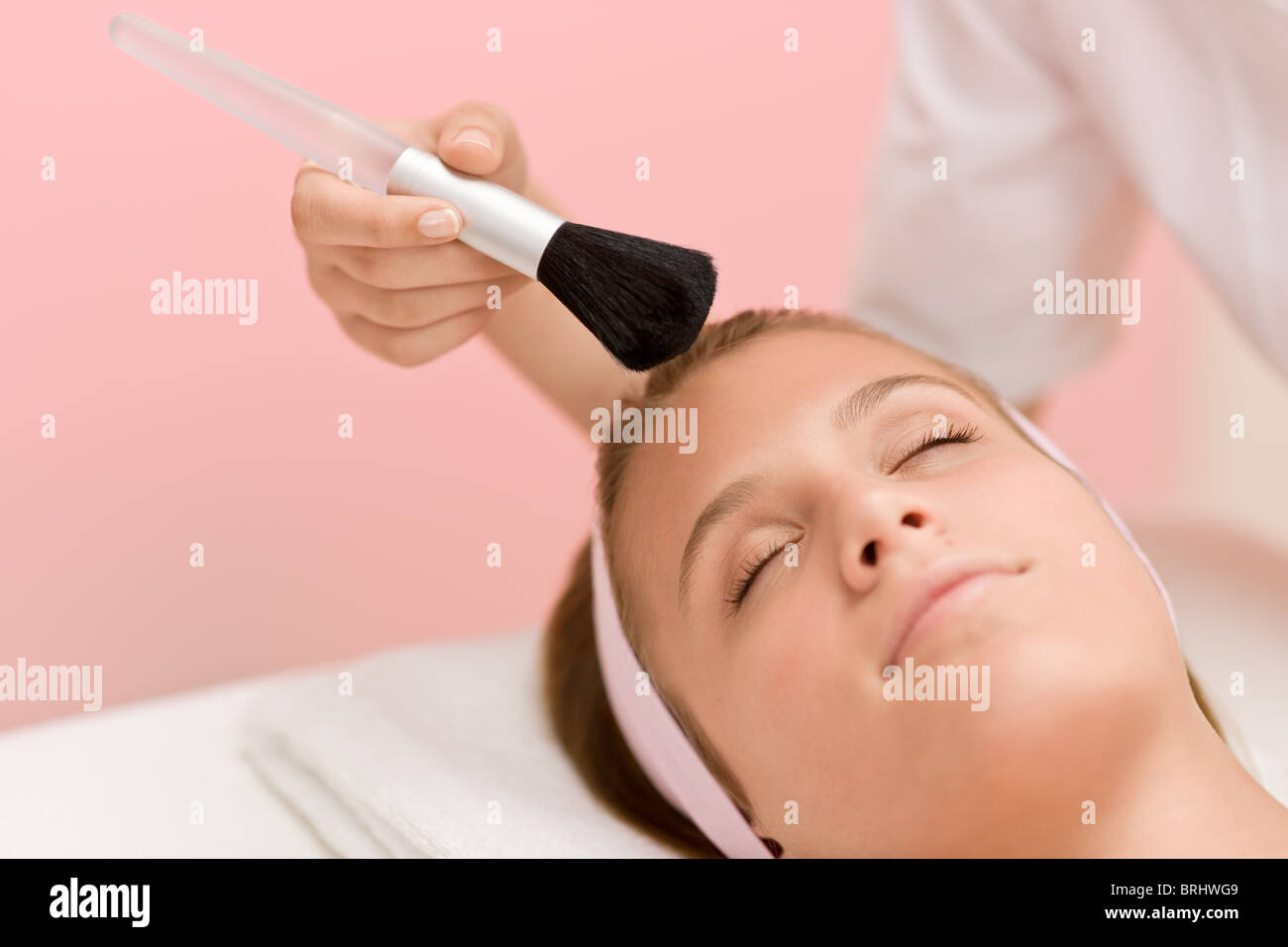Luxury facial care - woman in spa salon with beautician receiving ...