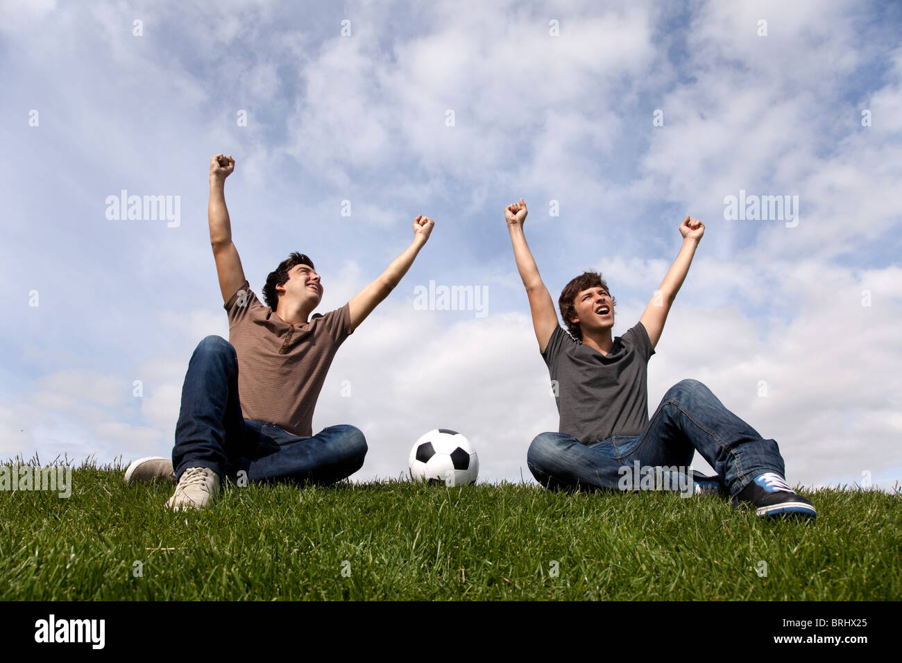 Two young men celebrating a goal from there soccer team Stock Photo - Alamy