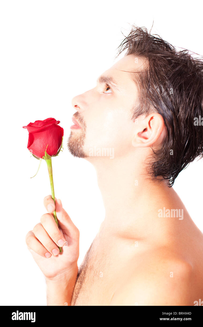 Profile of young men smell the red rose isolated on white background ...