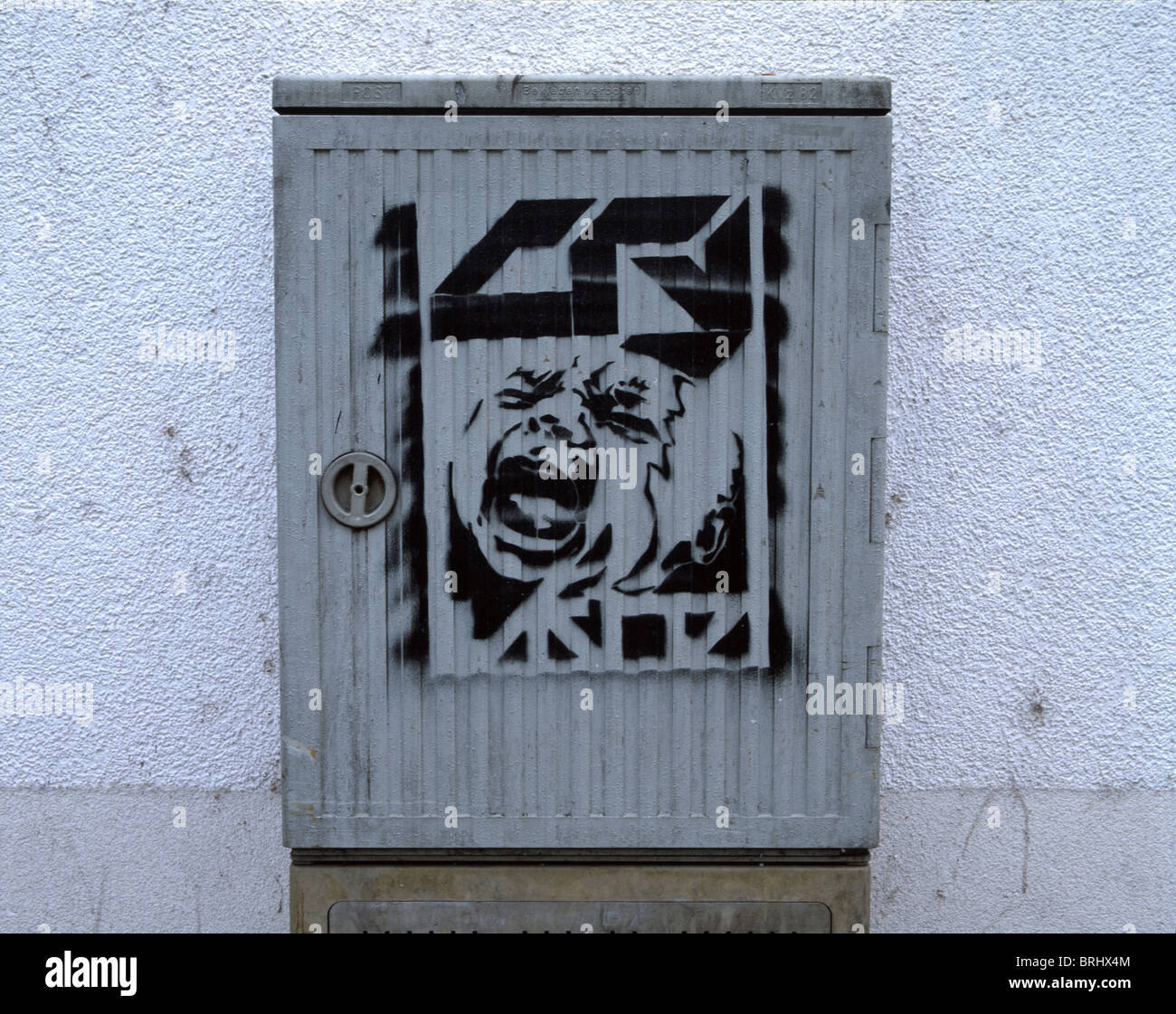 Stencil showing crying baby on a gray box in Munich, Germany Stock ...