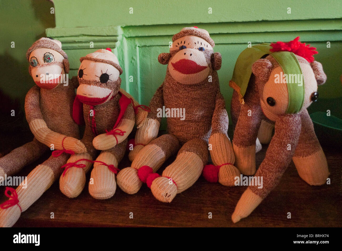 4 sock monkeys sitting on table Stock Photo - Alamy
