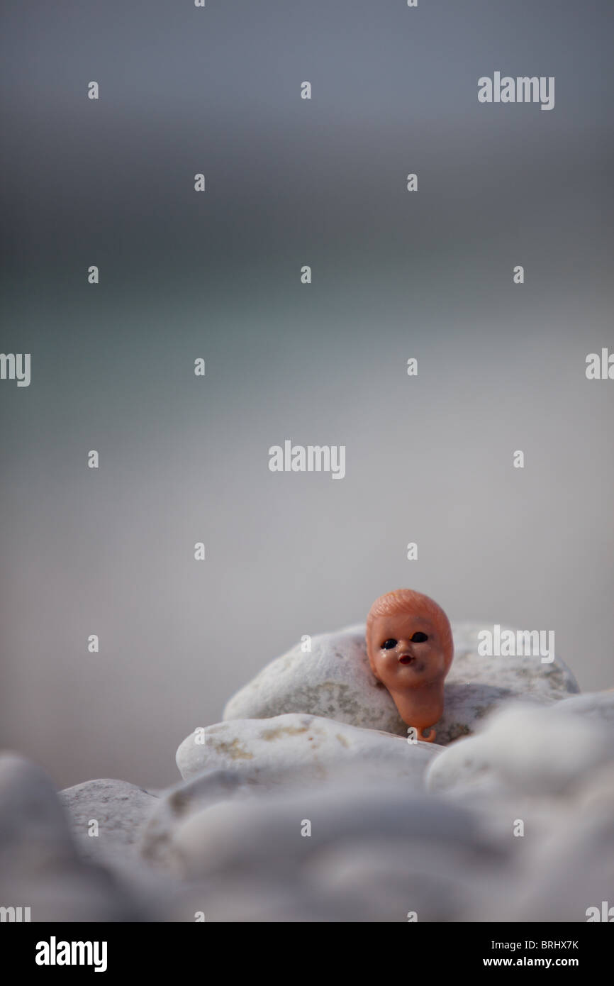 Doll head on beach hi-res stock photography and images - Alamy