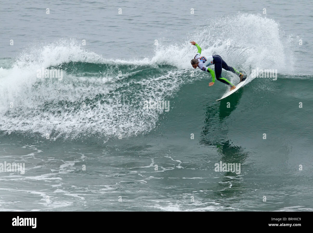 Pro female surfer competing in the "US Open of Surfing" at Huntington ...