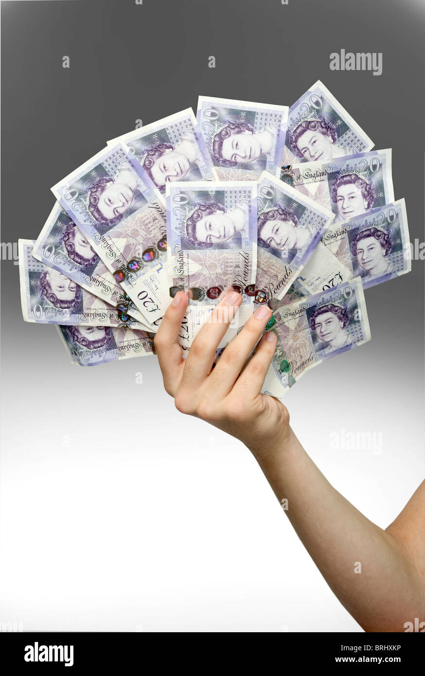 Hand holding british money hi-res stock photography and images - Alamy