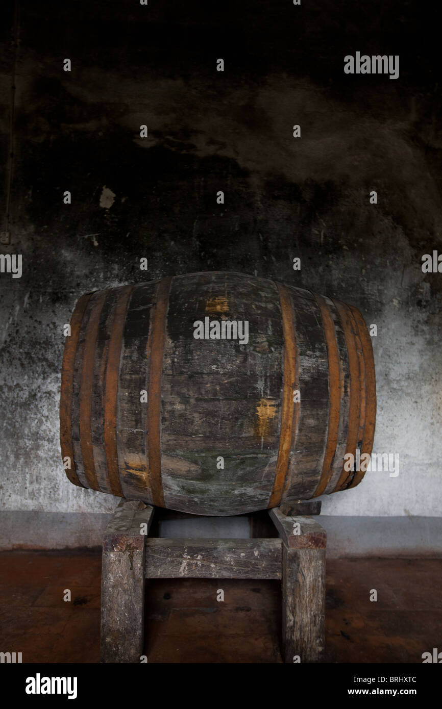 A picture of a old rusted wine barrel sitting upon a barrel stand in ...