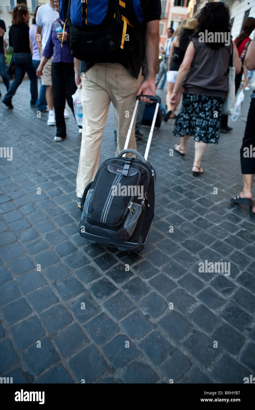 person man walking trolley bag in city town Stock Photo - Alamy