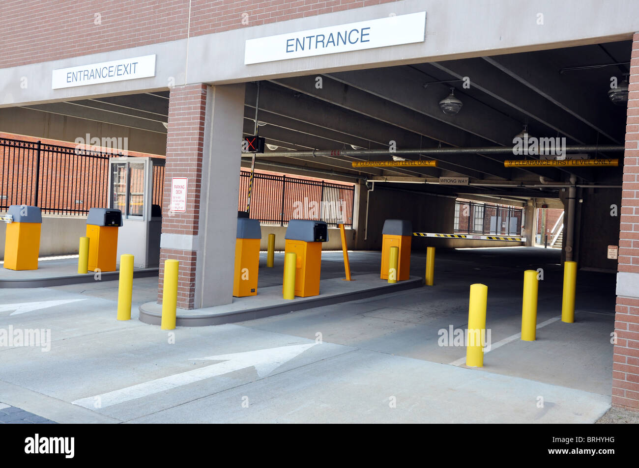 Parking deck entrance and exit with booth Stock Photo - Alamy