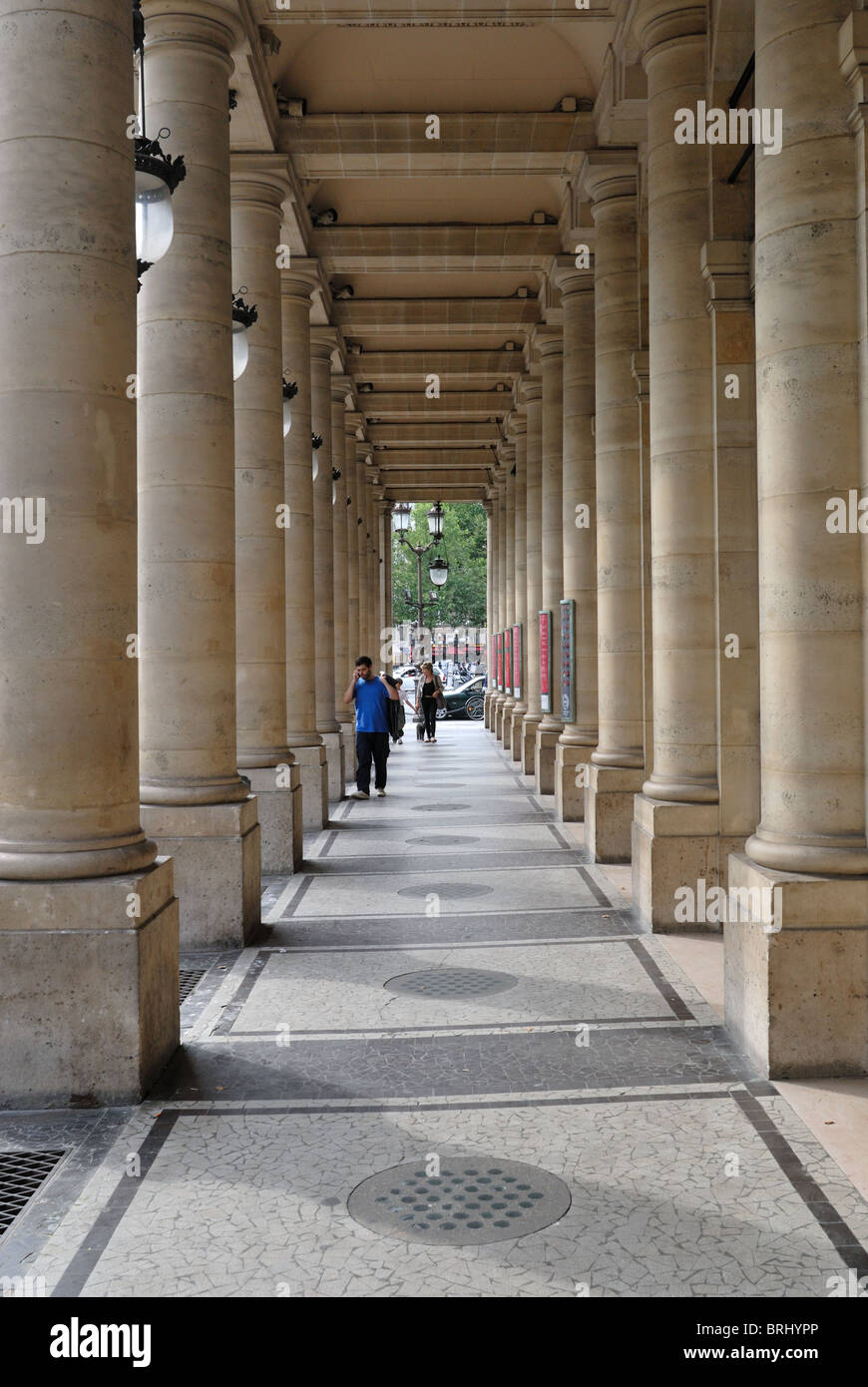 Circular stone columns creating a corridor with a marble sidewalk for ...