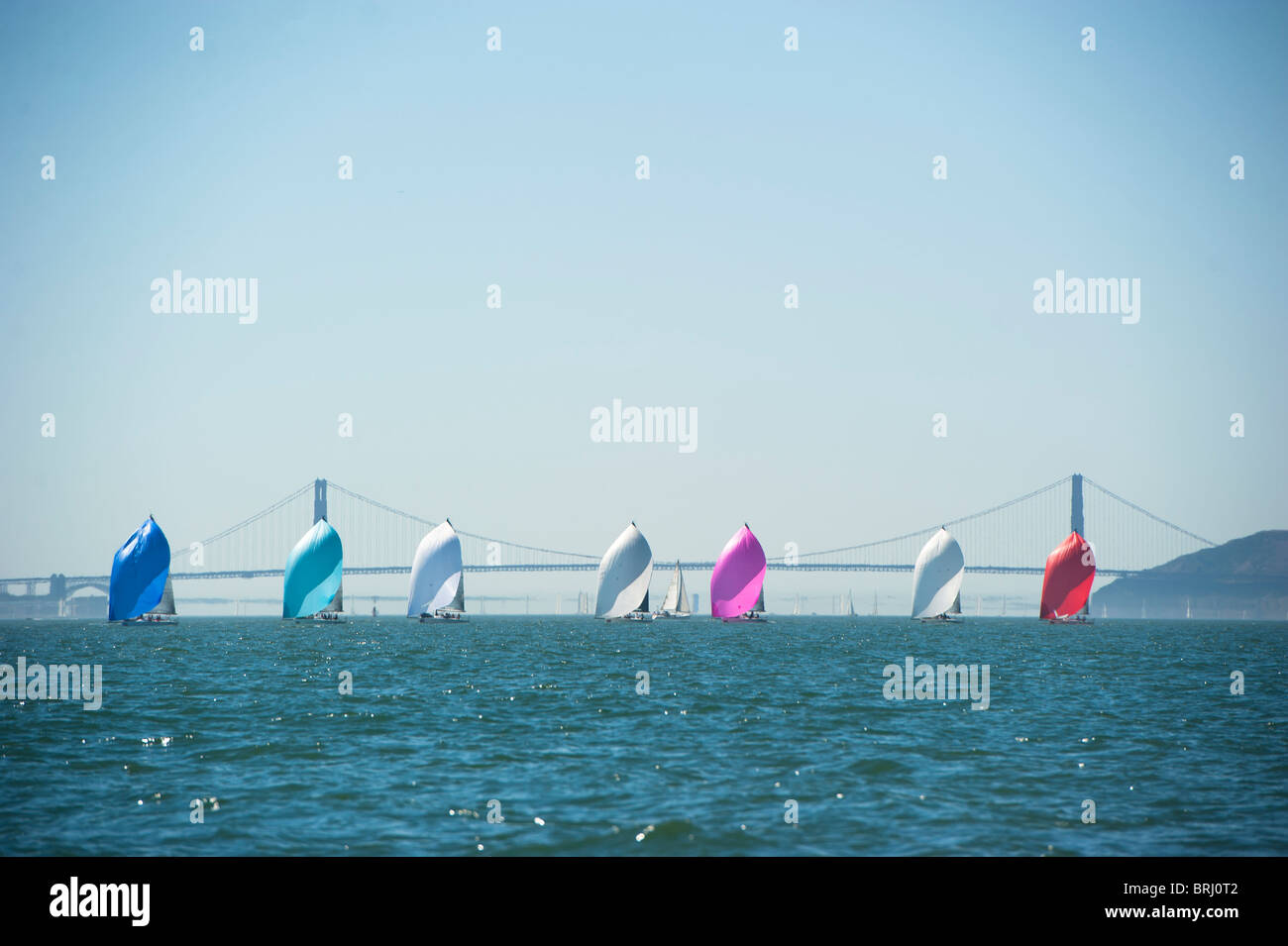 the melges 32 fleet arrayed in colorful spinnakers in front of the ...