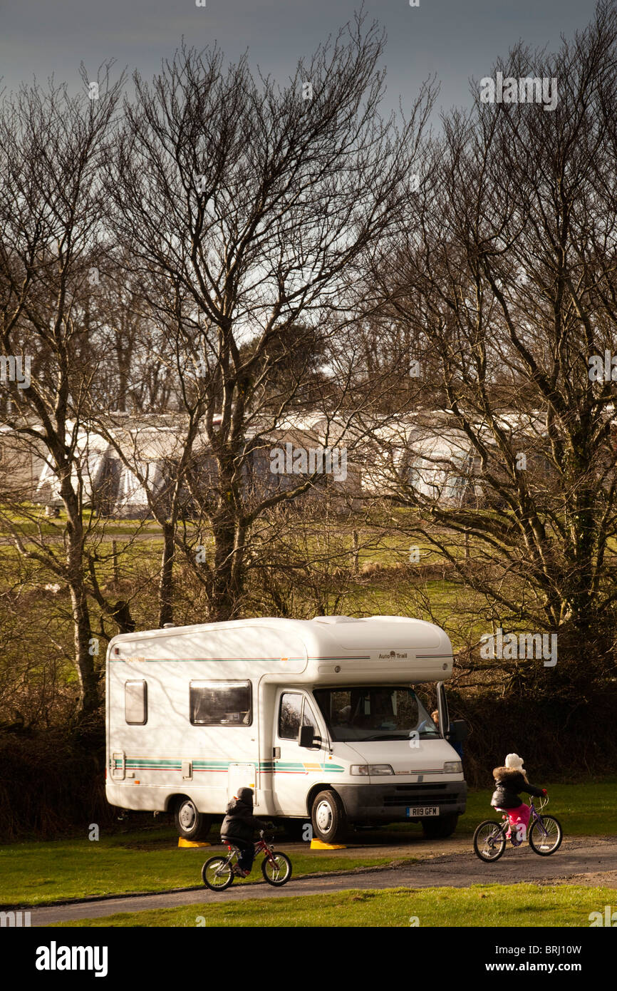 Children playing outside a motorhome on a caravan park, Barnstaple ...