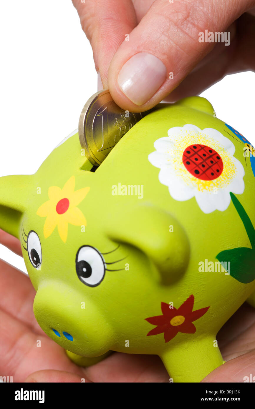coin in a piggy bank Stock Photo - Alamy