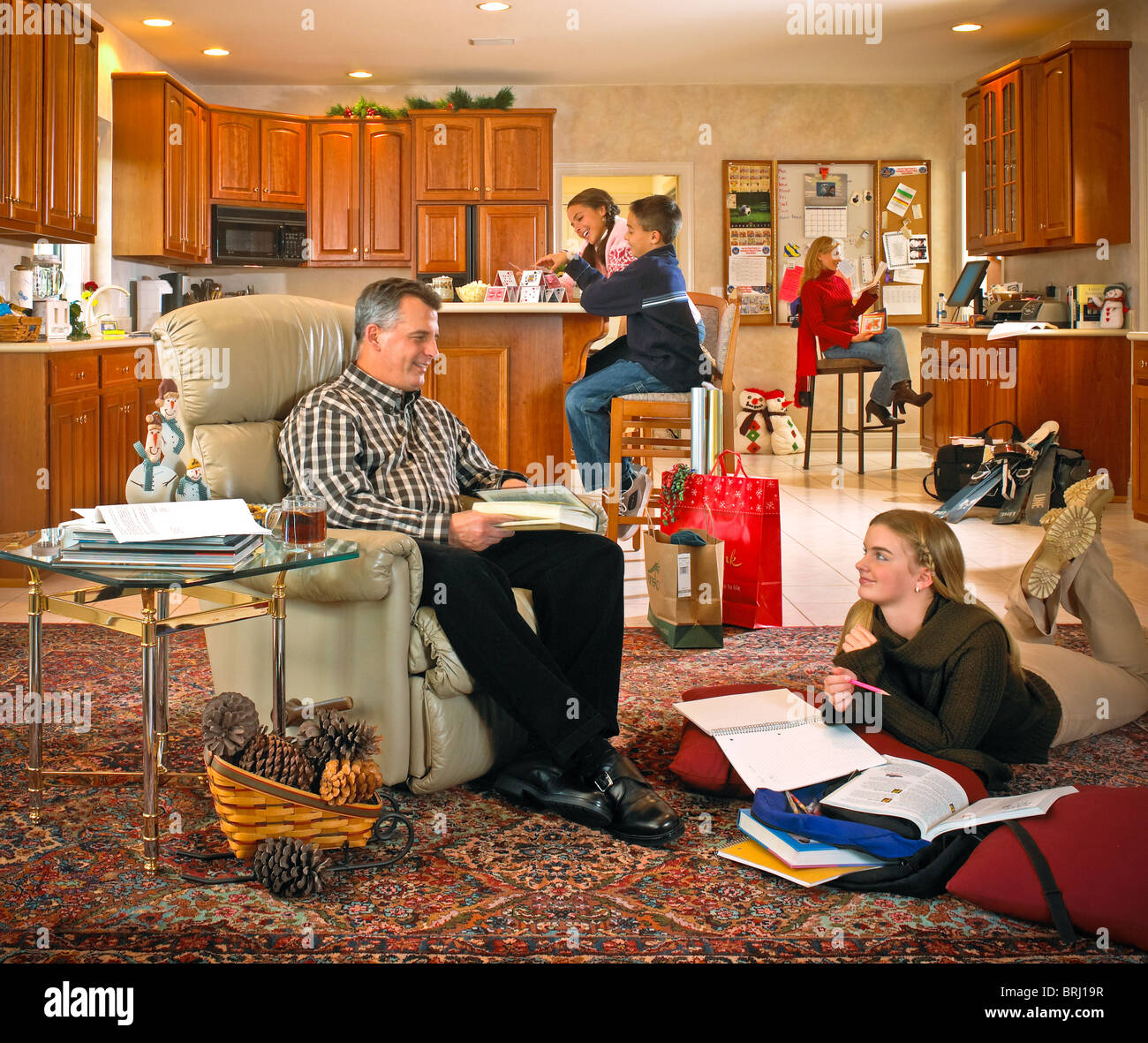 Family group relax and study in home family area Stock Photo - Alamy