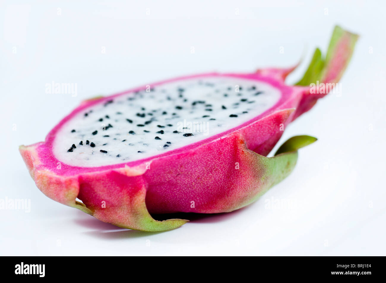 Close up of dragon fruit cross section on white Stock Photo - Alamy