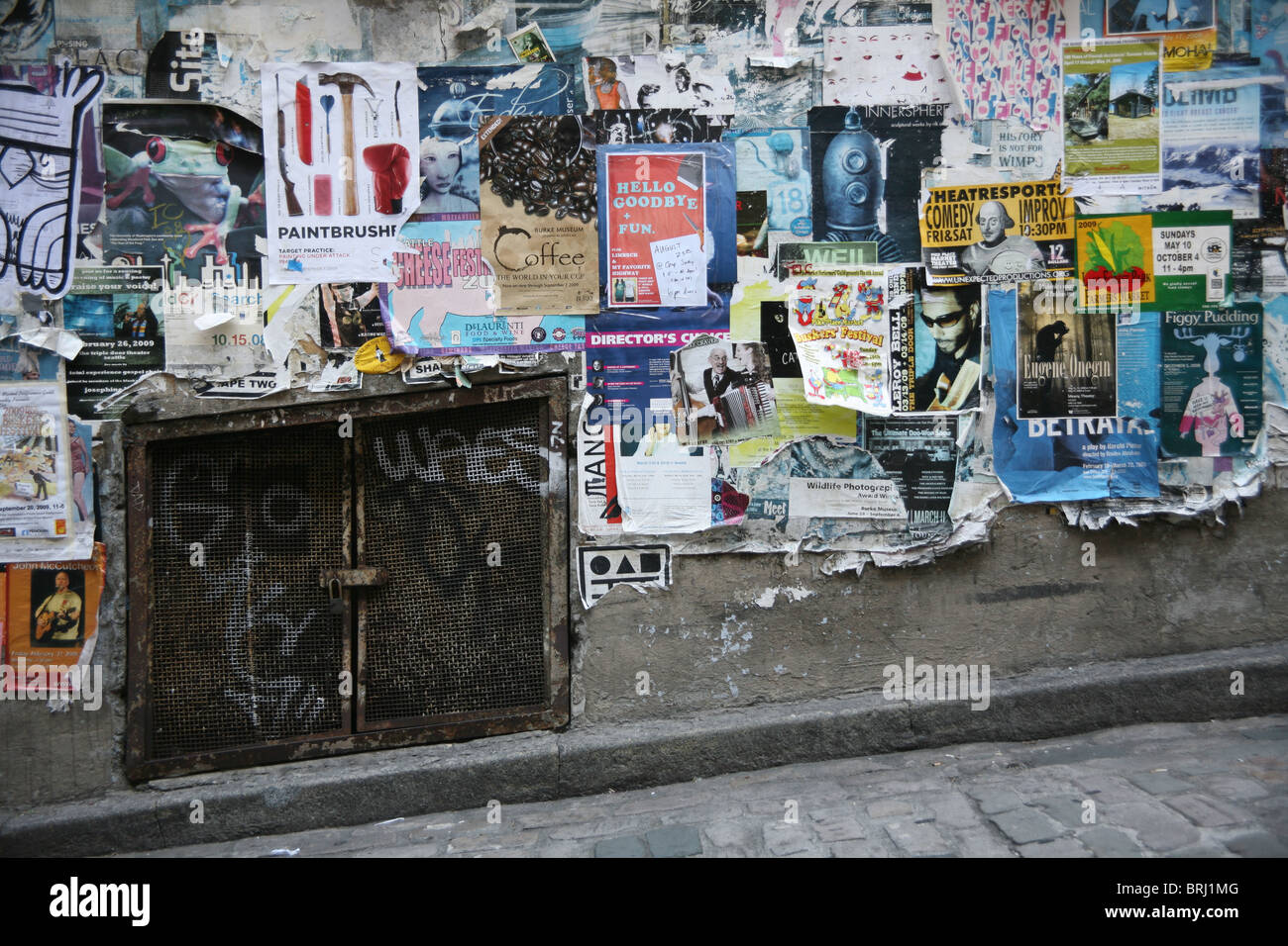 Flyers and posters posted on wall leading down to Post Alley in Seattle ...