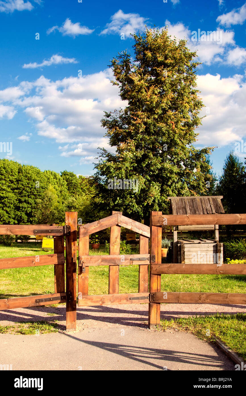road gate trees and sky with clouds Stock Photo - Alamy