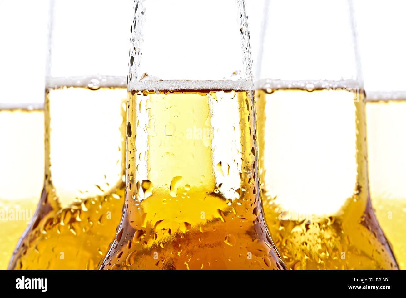 beer bottles with water droplets closeup on white Stock Photo - Alamy