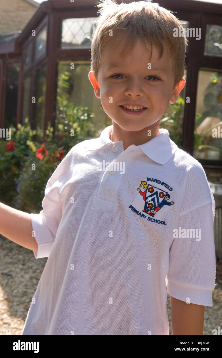 Portrait of young schoolboy smiling, looking happy Stock Photo - Alamy