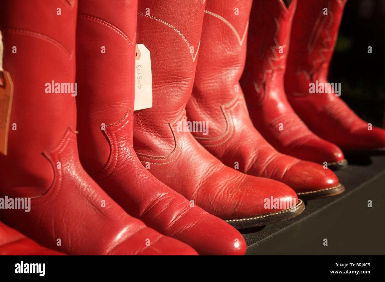 Red cowboy boots in a row image id hi-res stock photography and images ...